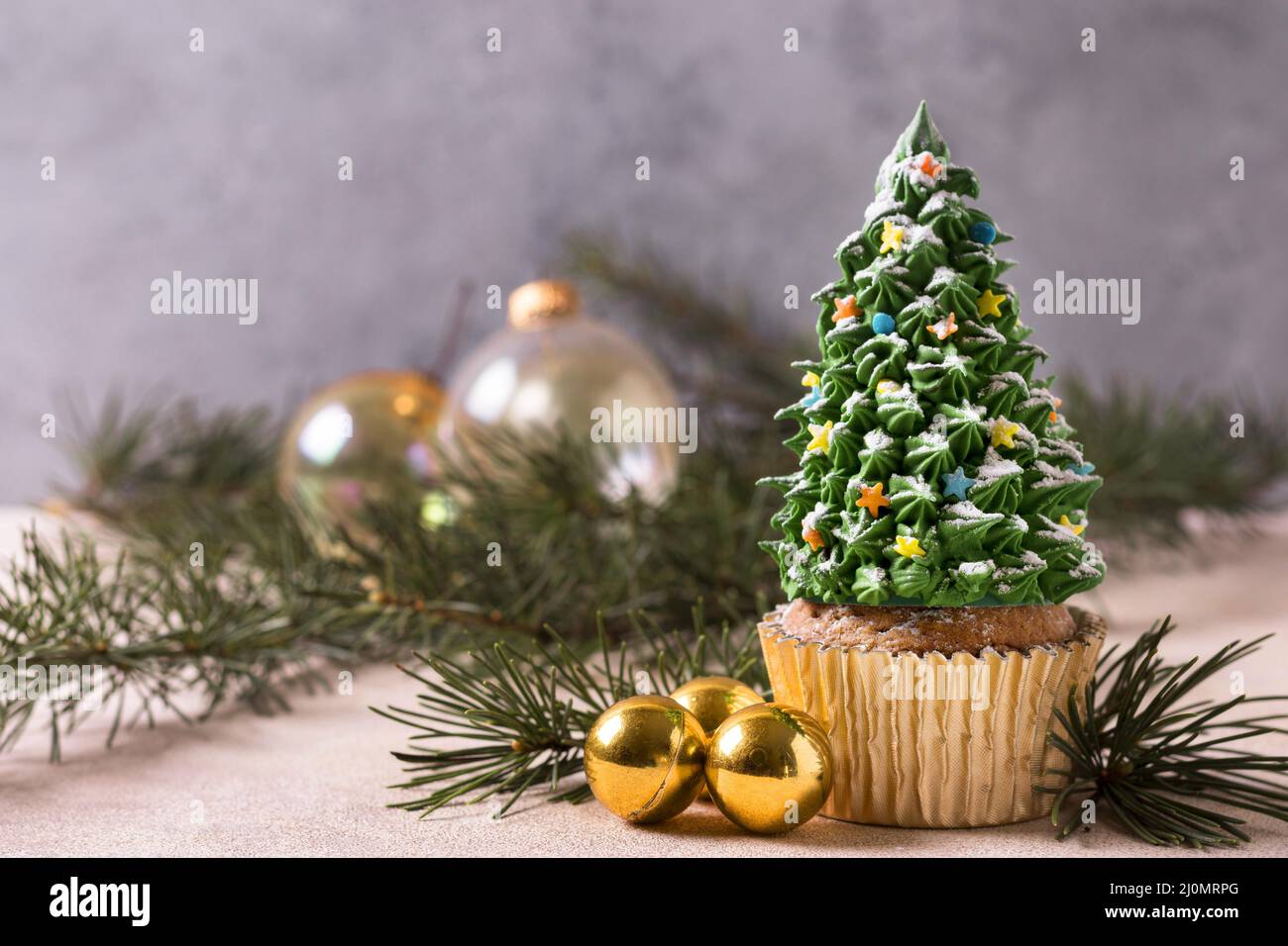 Front view cupcake with christmas tree frosting Stock Photo - Alamy