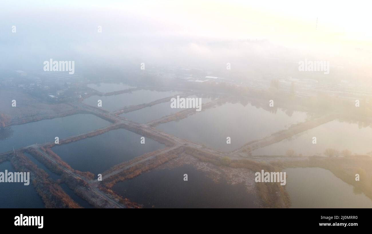 Aerial Drone View Flight Over artificially dug ponds for fish farming ...