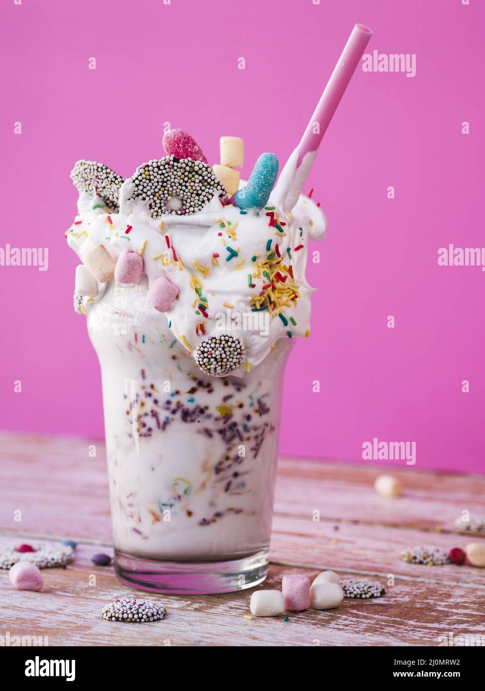 Front view delicious milkshake wooden table Stock Photo - Alamy