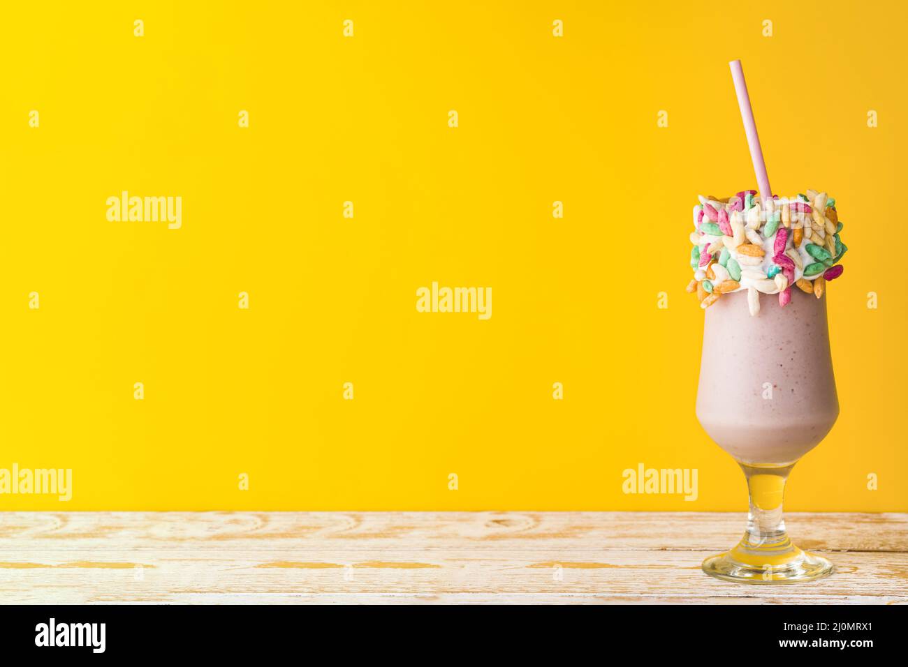 Front view delicious milkshake yellow background Stock Photo - Alamy