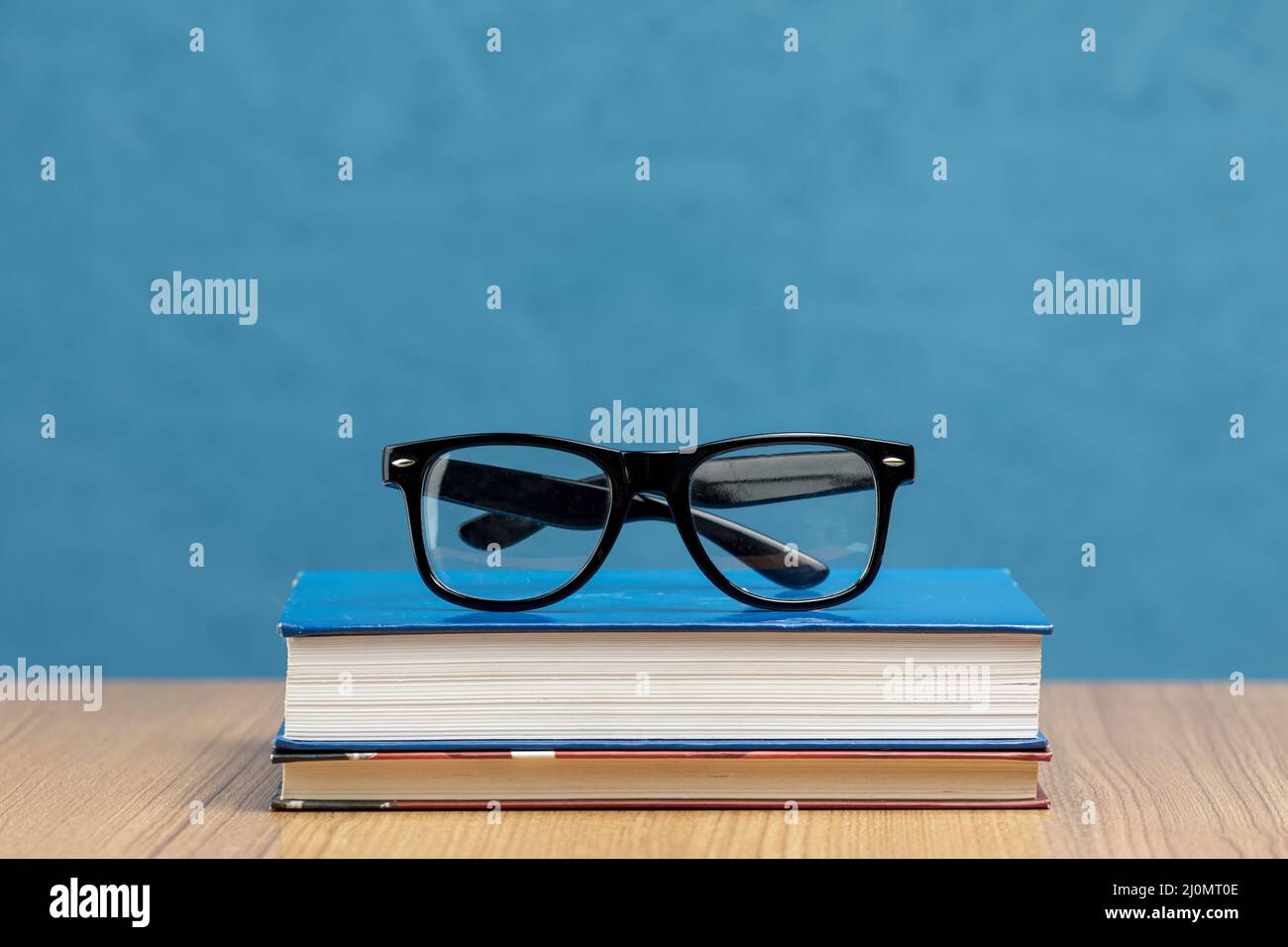 Front view books with glasses Stock Photo - Alamy