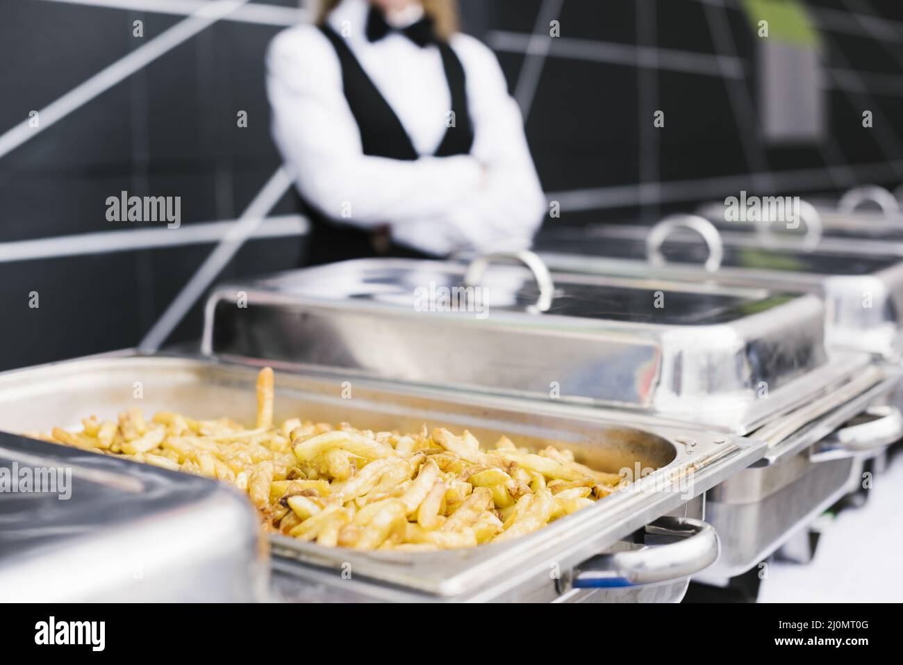 Freshly cut french fries buffet Stock Photo - Alamy