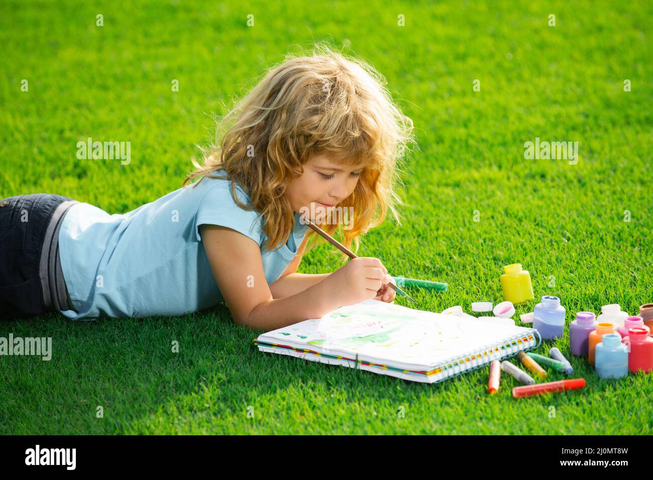 Child painting drawing art. Portrait of smiling happy kid enjoying art ...