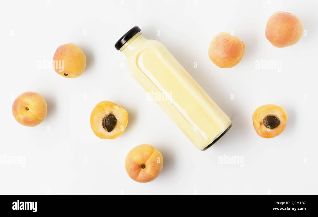 Flat lay peach juice bottle Stock Photo - Alamy