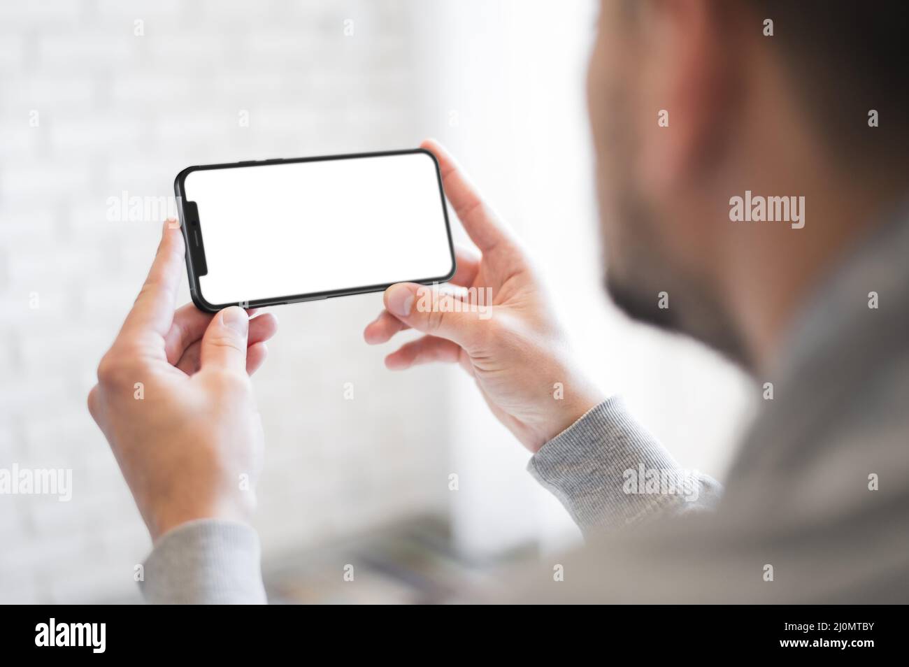 Close up man holding smartphone Stock Photo - Alamy