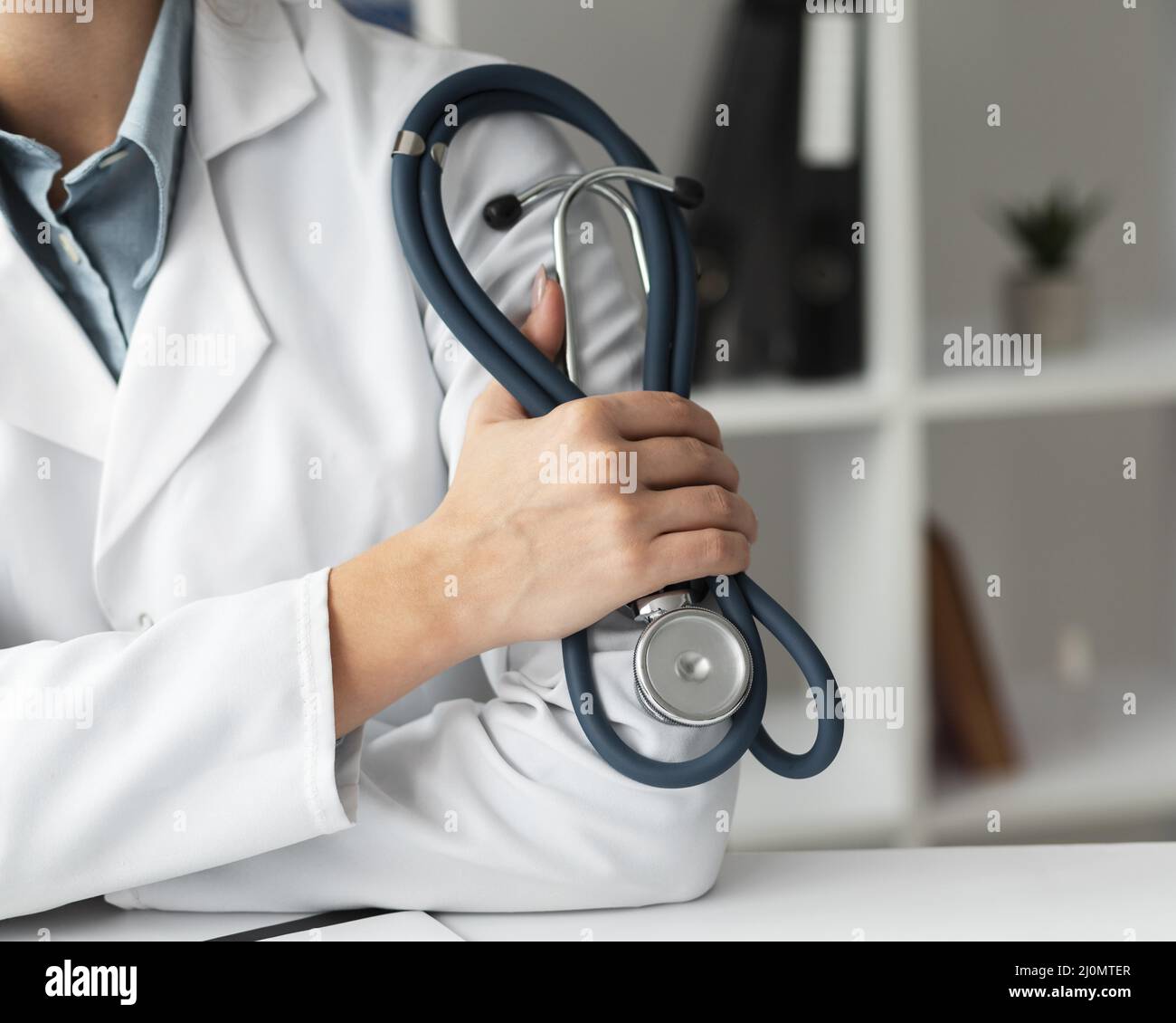 Close up doctor holding stethoscope Stock Photo - Alamy