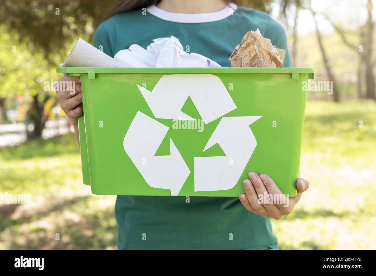 Close up woman holding recycling basket nature Stock Photo - Alamy