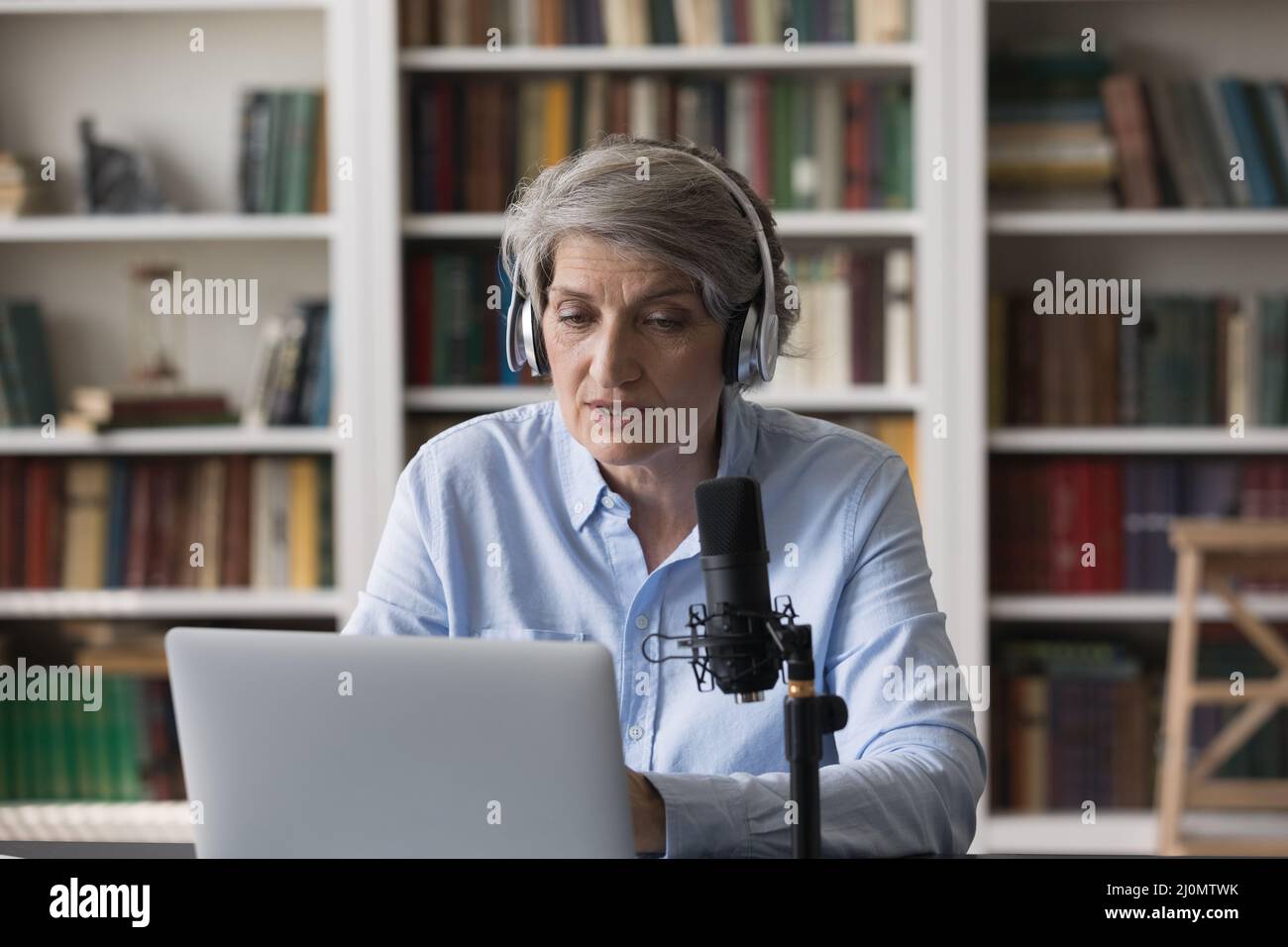 60s woman wear headphones make speech, lead broadcasting on-air Stock ...