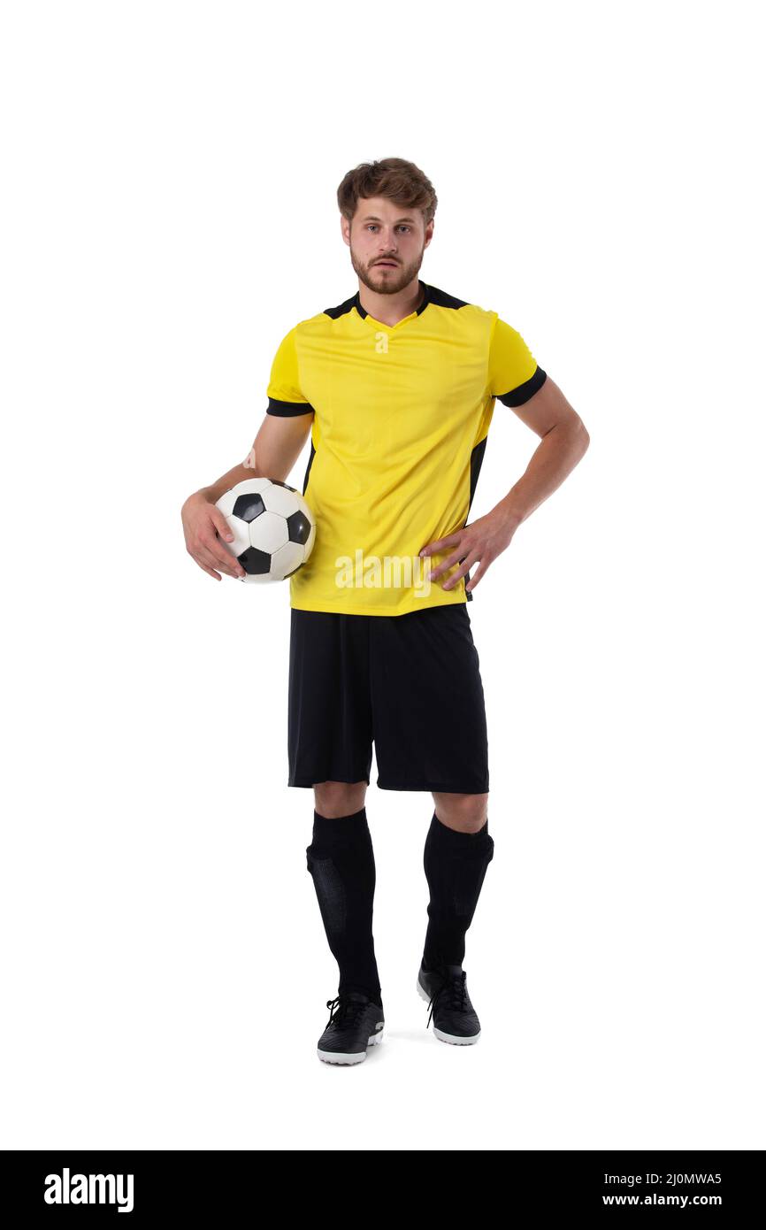 Full length portrait of a soccer player with ball isolated on white ...