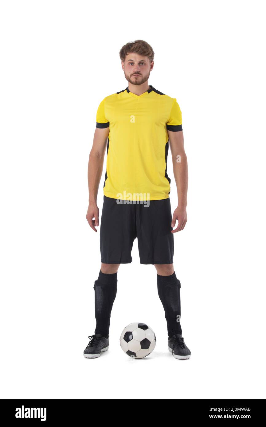 Full length portrait of a soccer player with ball isolated on white ...