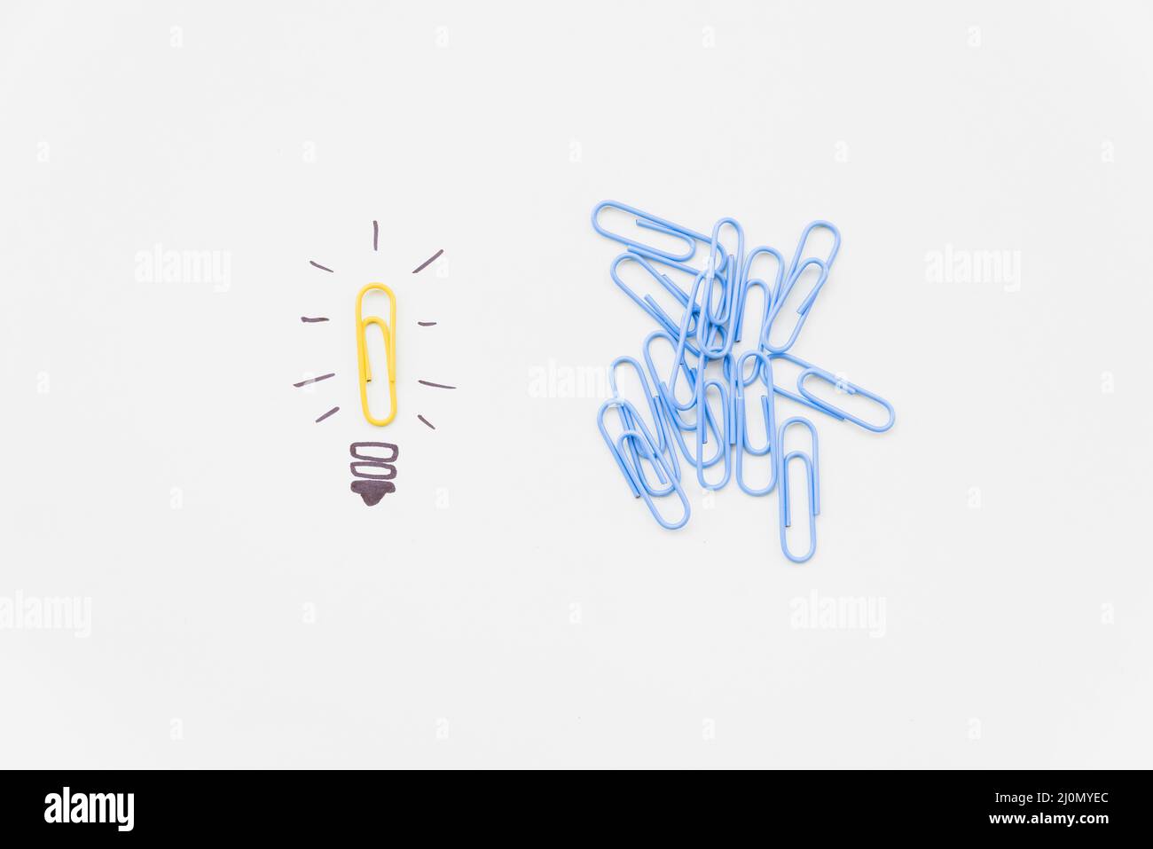 Bulb drawing with yellow paperclip as light Stock Photo - Alamy