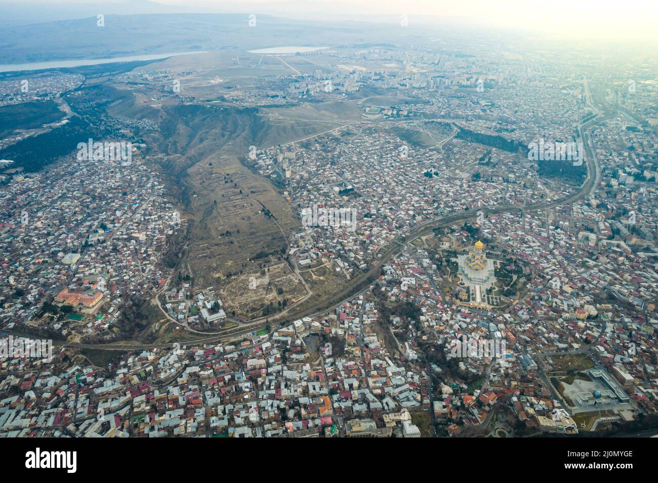 Aerial view of Tbilisi city center with churches and modern buildings ...