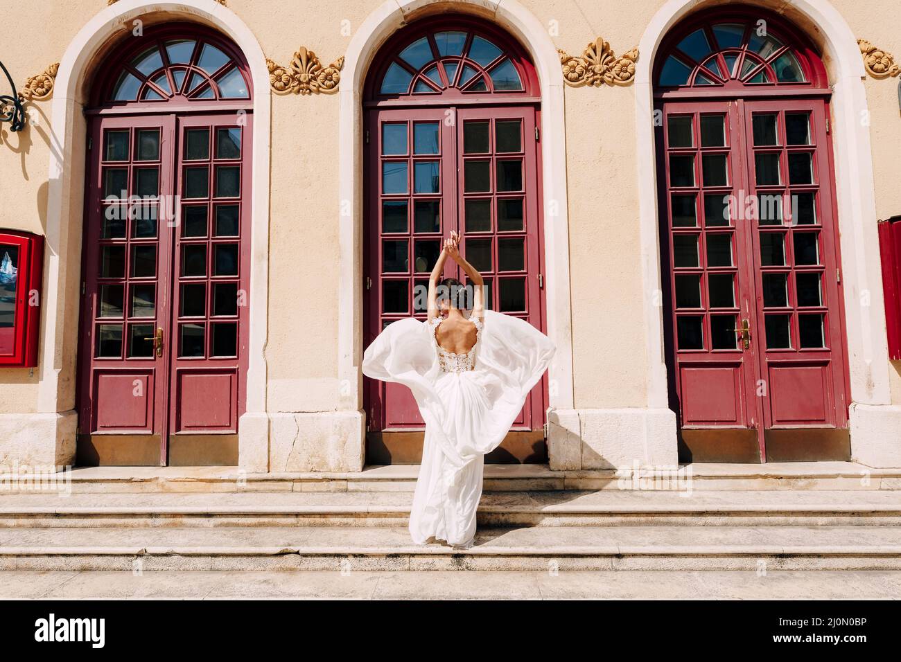 Sibenik, Croatia - 05.06.17: Bride in a white dress fluttering in the ...