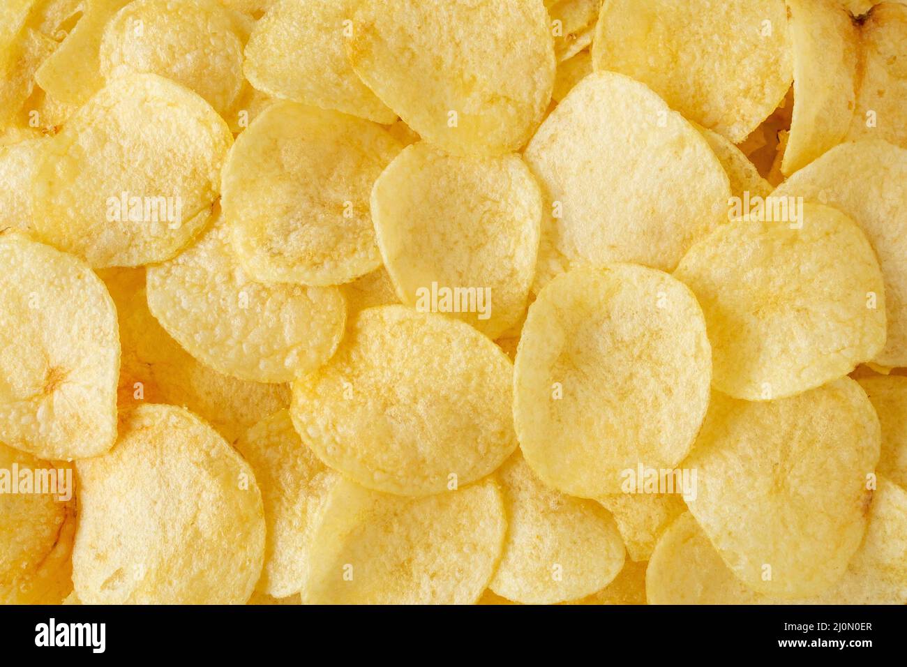 crispy potato chips snack texture background top view Stock Photo - Alamy