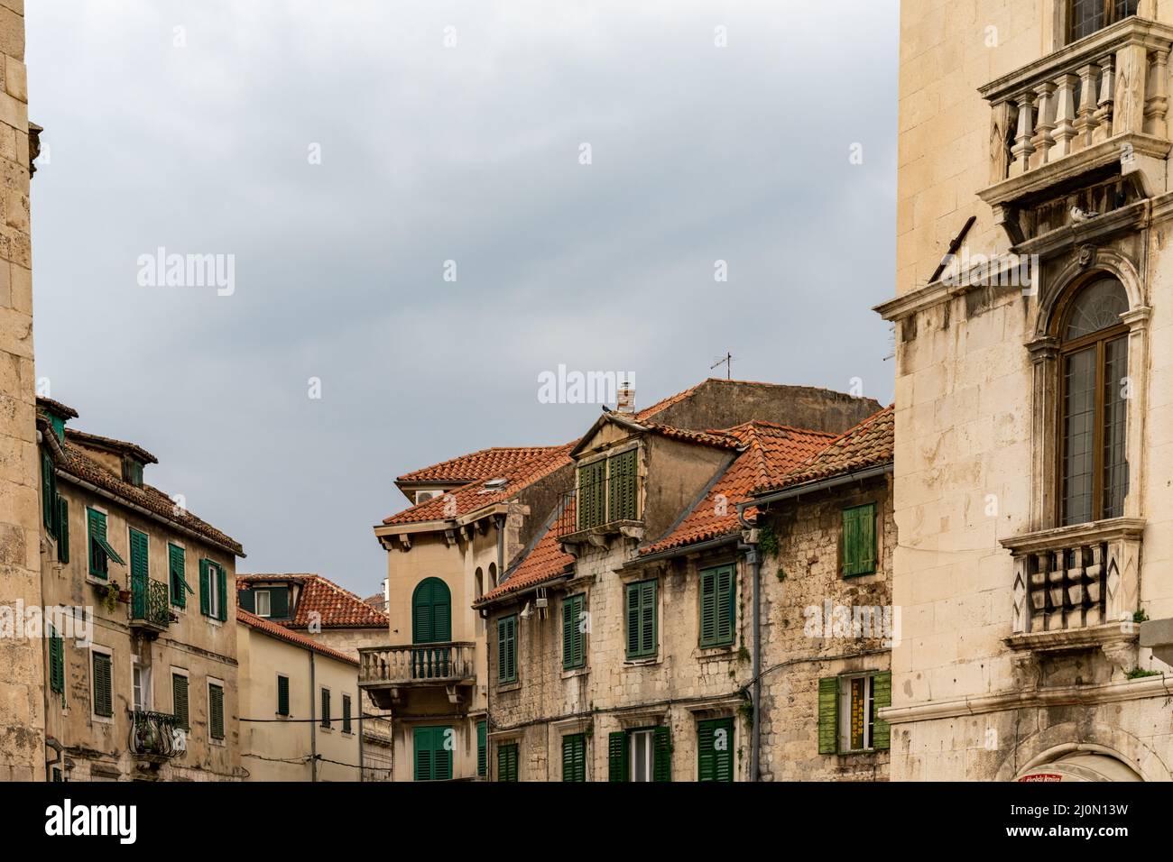 Old buildings in the historic city center of Split with an overcast sky ...