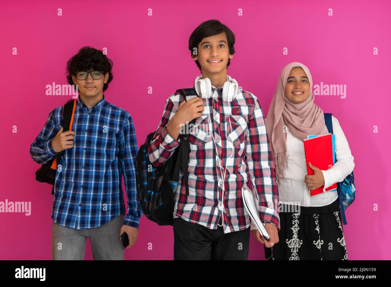 A group of Arab teenagers, a student team walking forward into the ...