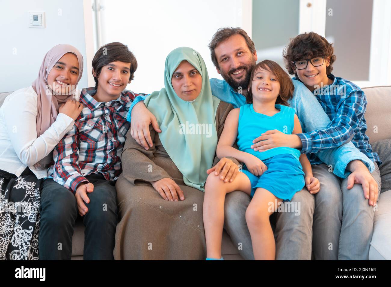 Modern muslim family sofa hi-res stock photography and images - Alamy