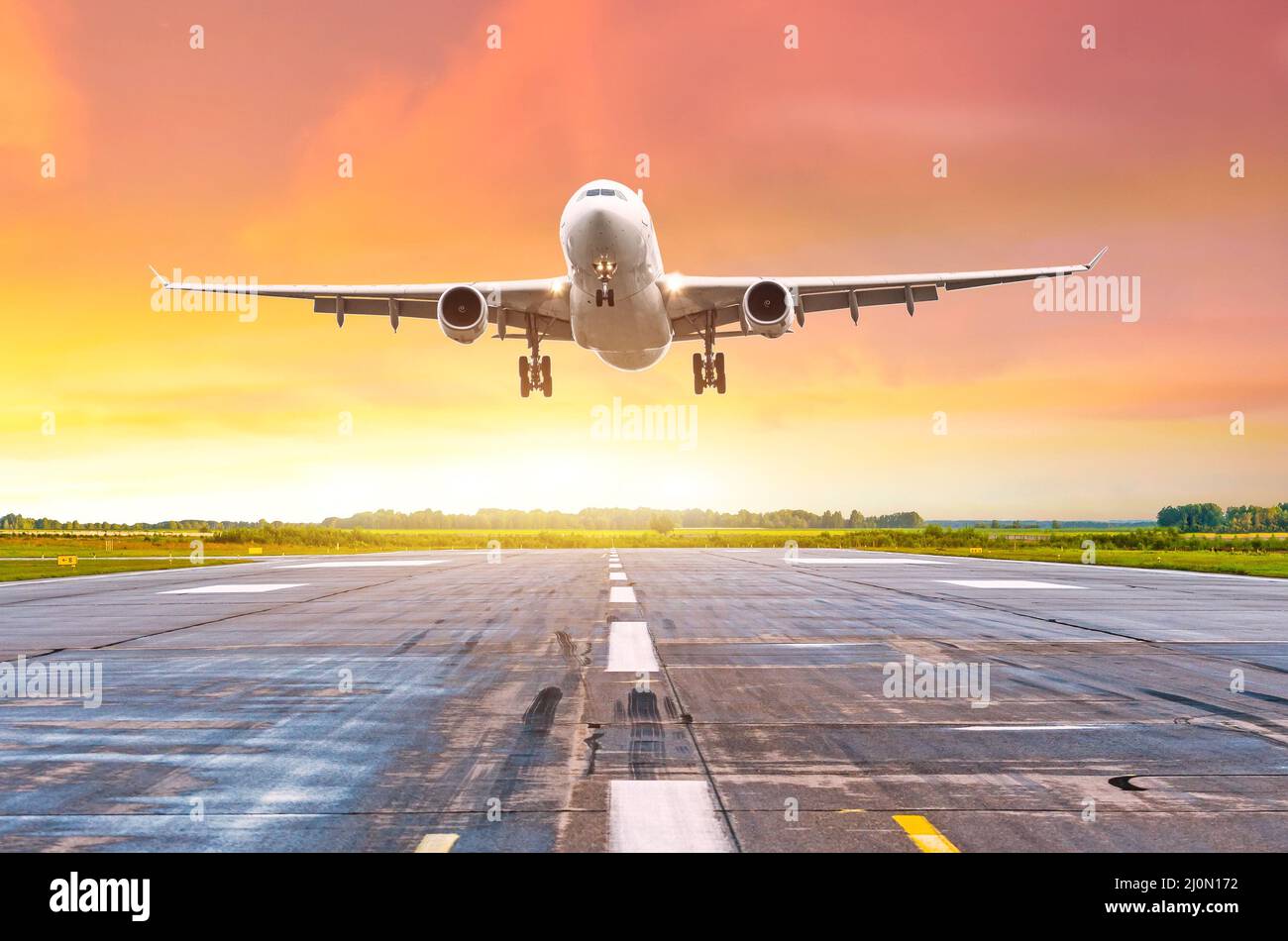 Big long-haul aircraft flying deperture landing on a runway in the ...