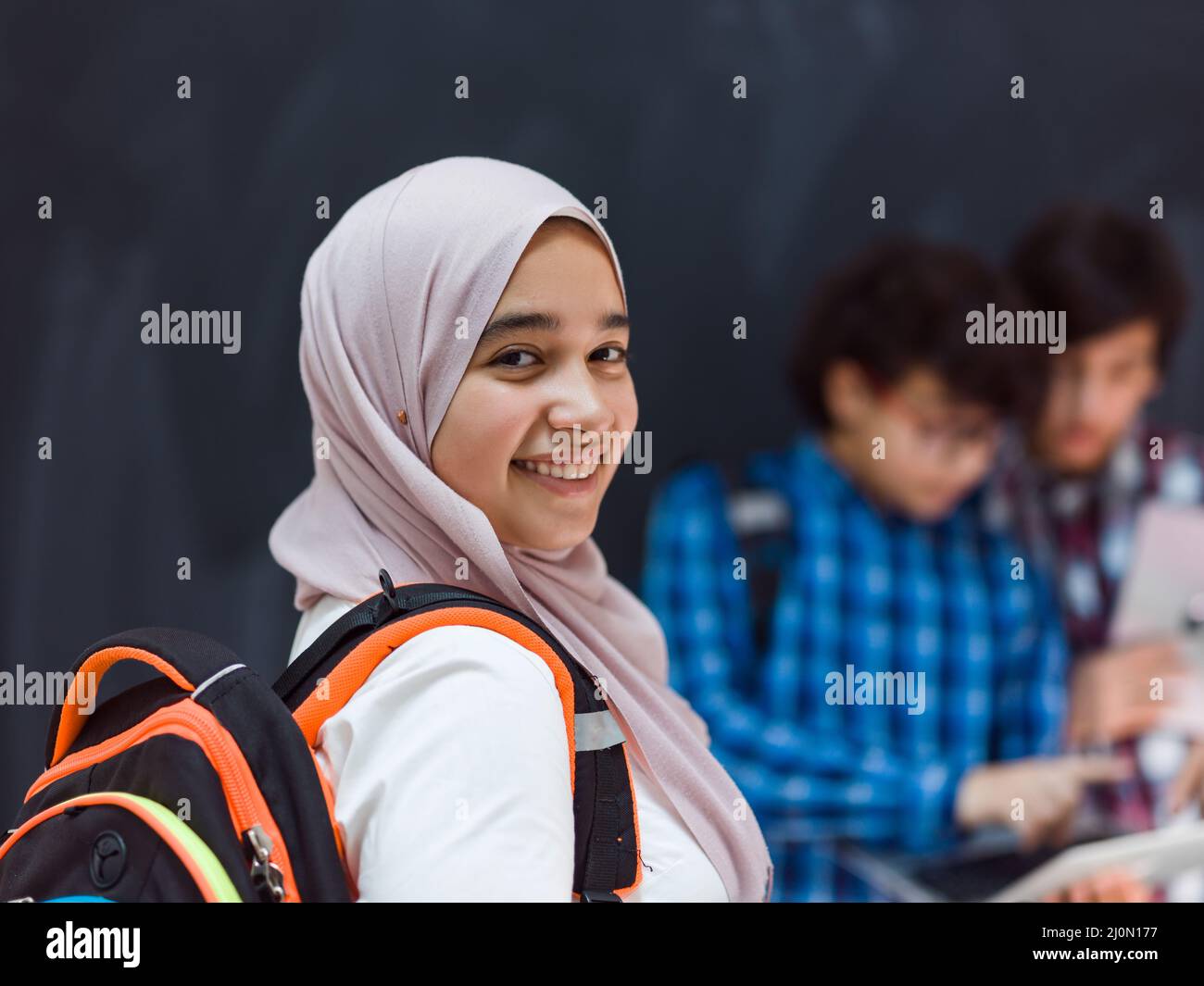 Modern arab teens use smartphone, tablet and latpop to study during ...