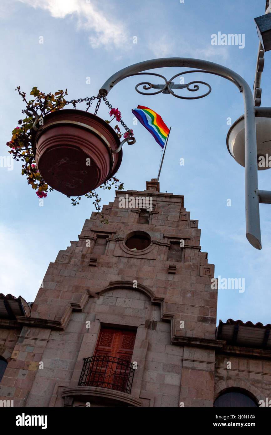 Beautiful view of a Rainbow flag on top of a historical tower in ...