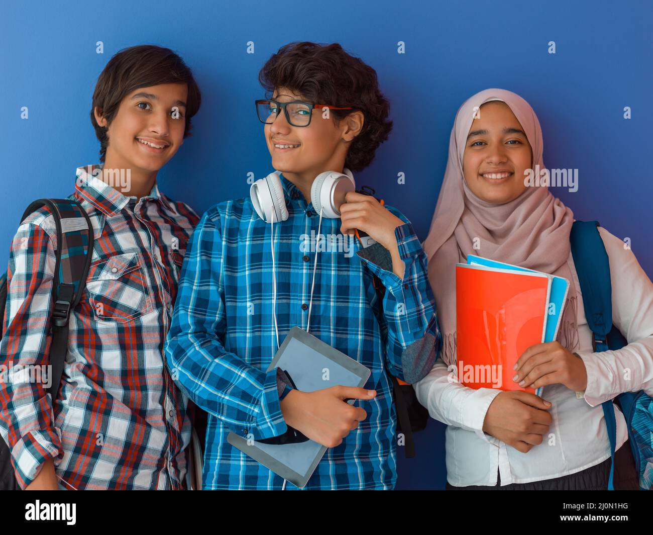 Modern arab teens use smartphone, tablet and latpop to study during ...
