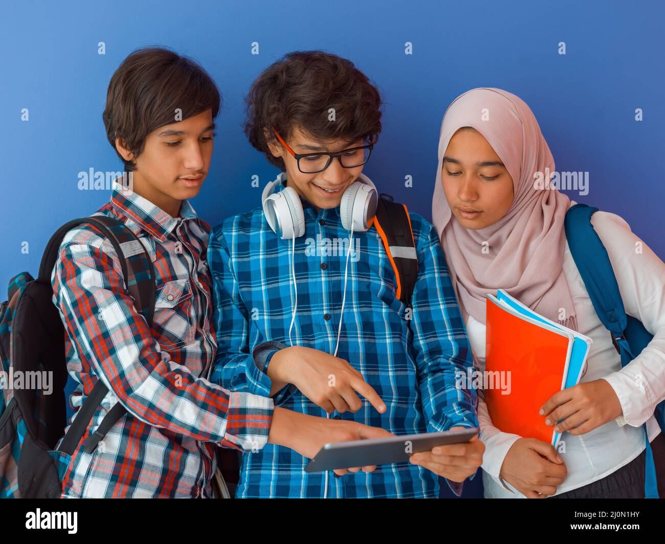 Modern arab teens use smartphone, tablet and latpop to study during ...