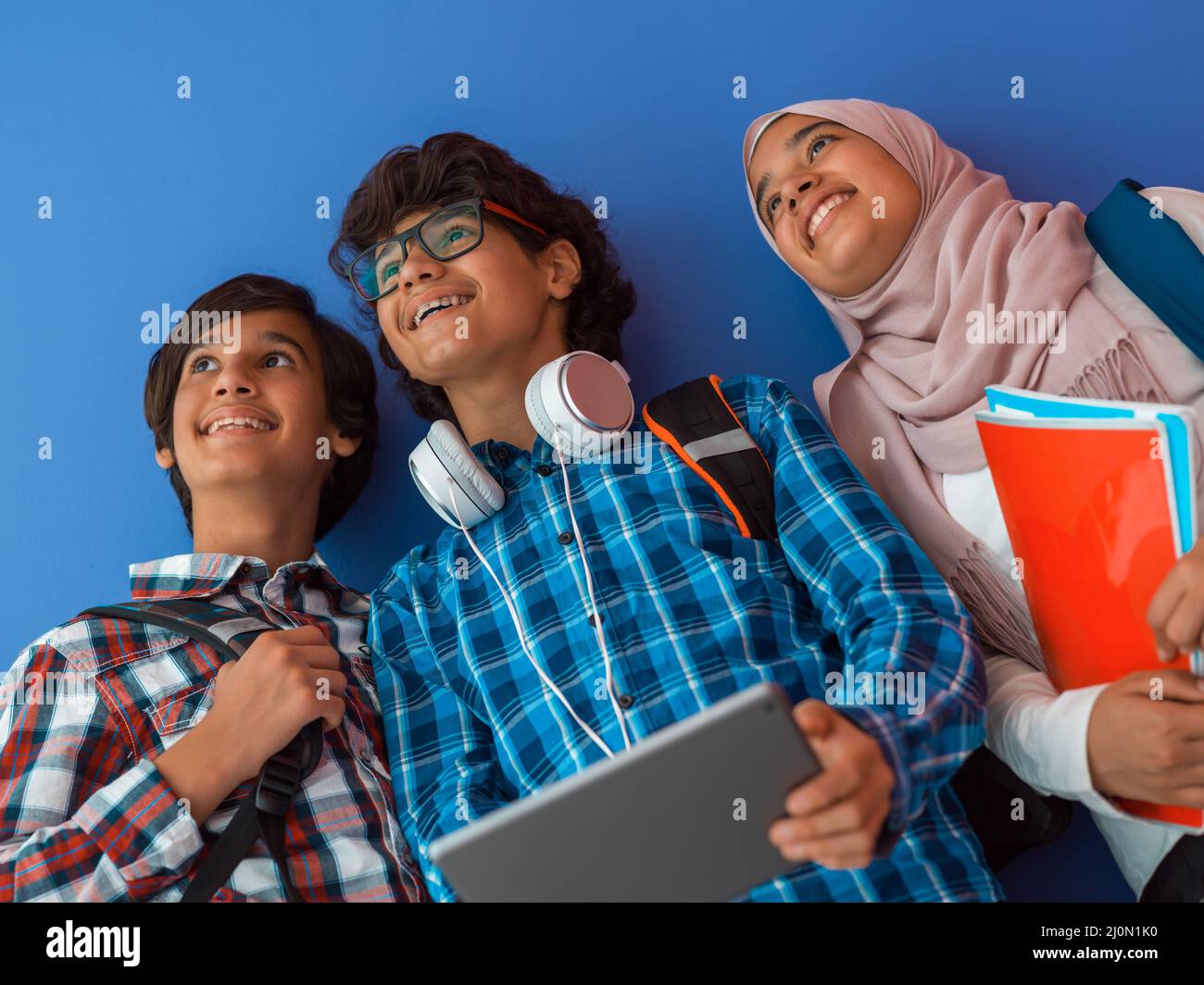 Modern arab teens use smartphone, tablet and latpop to study during ...