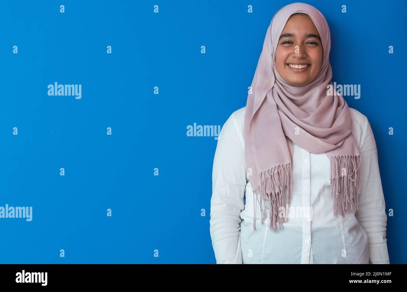 Arab female Muslim in traditional hijab clothes for praying namaz ...