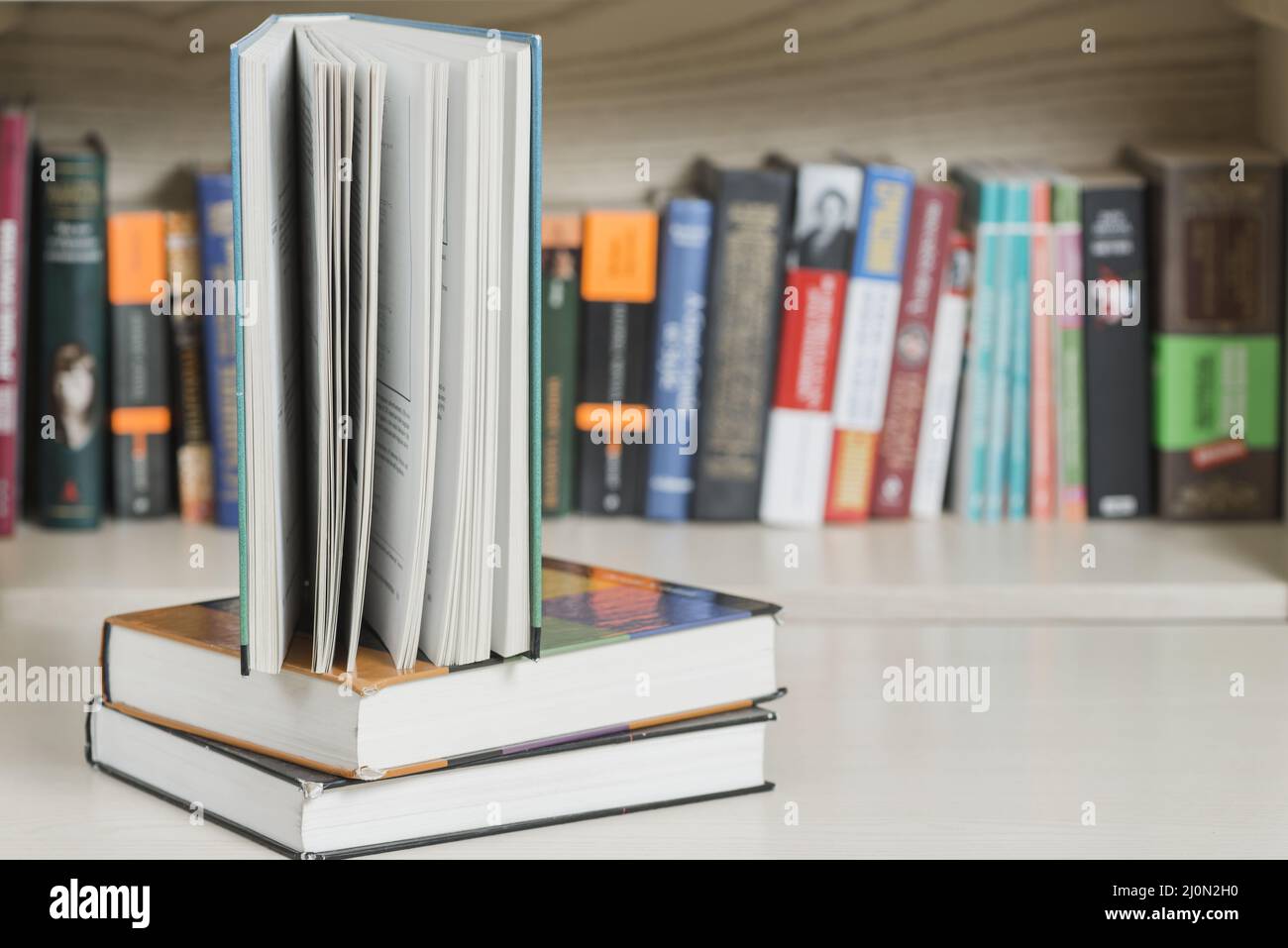 Book standing pile Stock Photo - Alamy