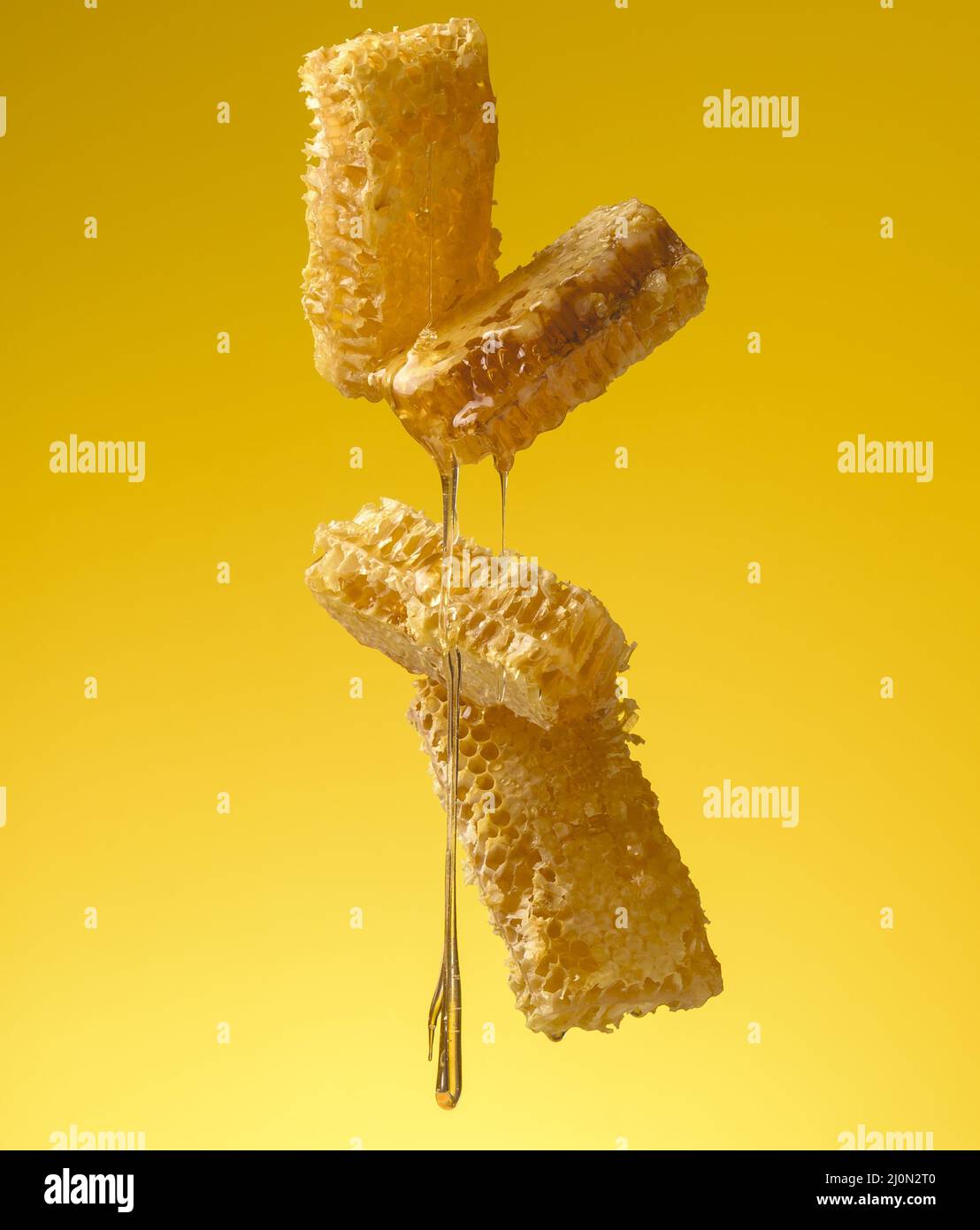 Honeycomb with flowing honey hi-res stock photography and images - Alamy
