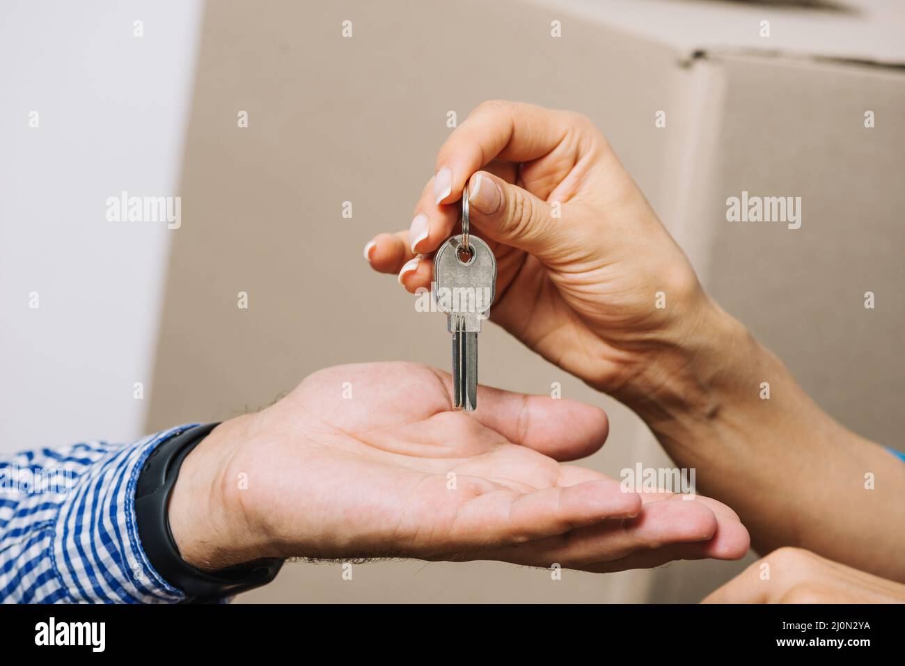 Crop people exchanging with keys Stock Photo - Alamy