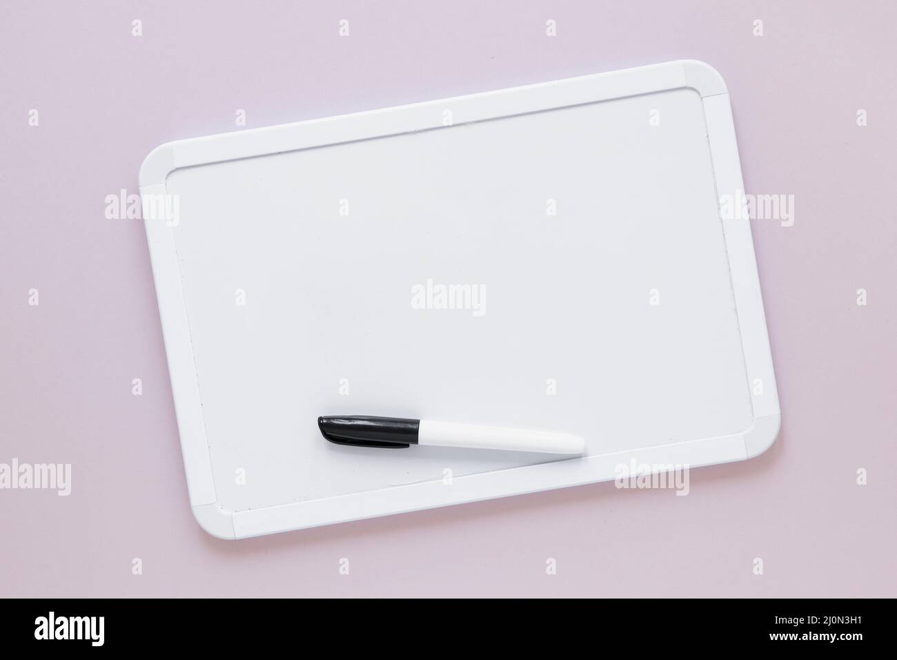 Flat lay whiteboard with marker top Stock Photo - Alamy