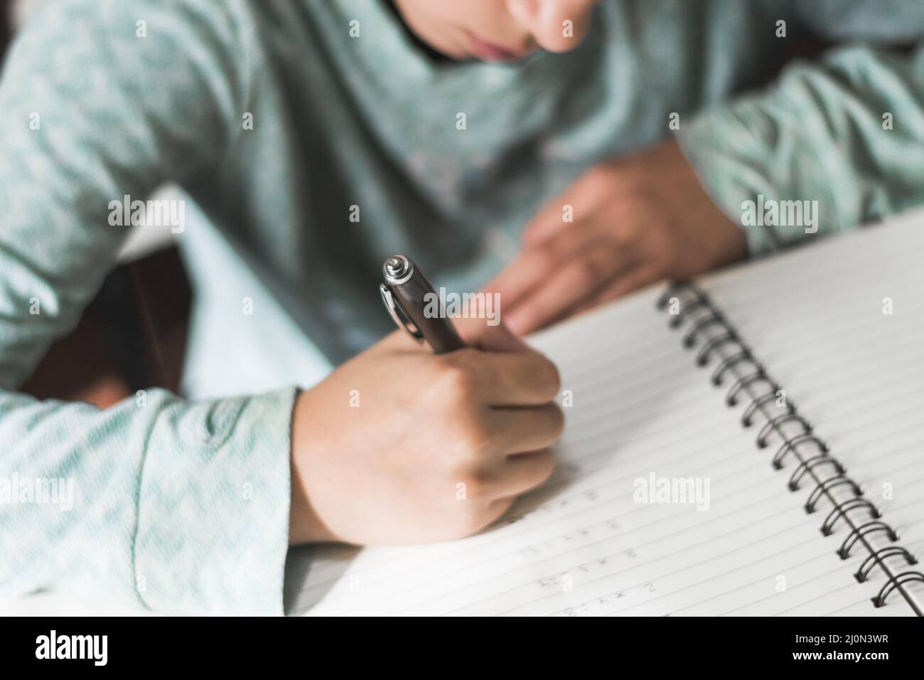 Adorable preteen girl writing hi-res stock photography and images - Alamy