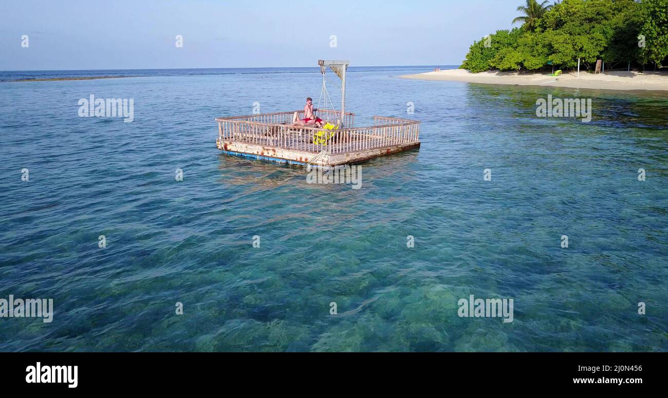 Man relaxing on beach floating hi-res stock photography and images - Alamy