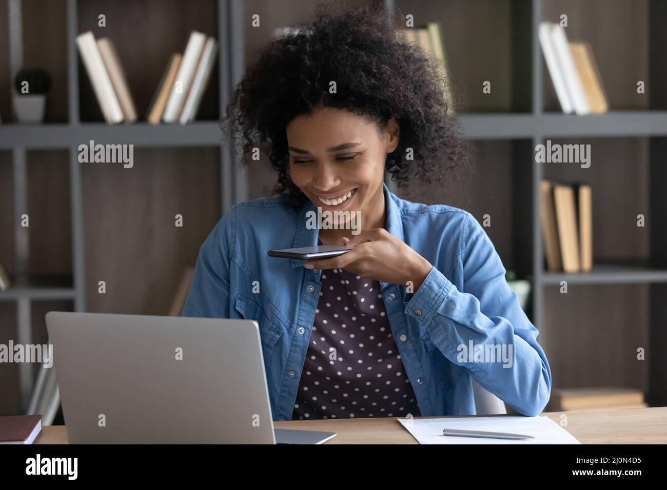 Happy African entrepreneur girl making mobile phone call Stock Photo ...
