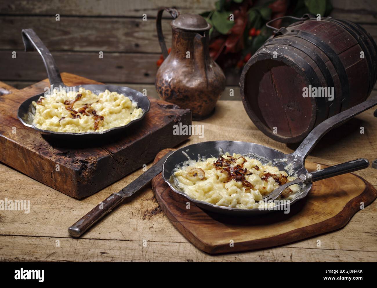 Traditional Swabian cheese spaetzle with fried onions served as close ...