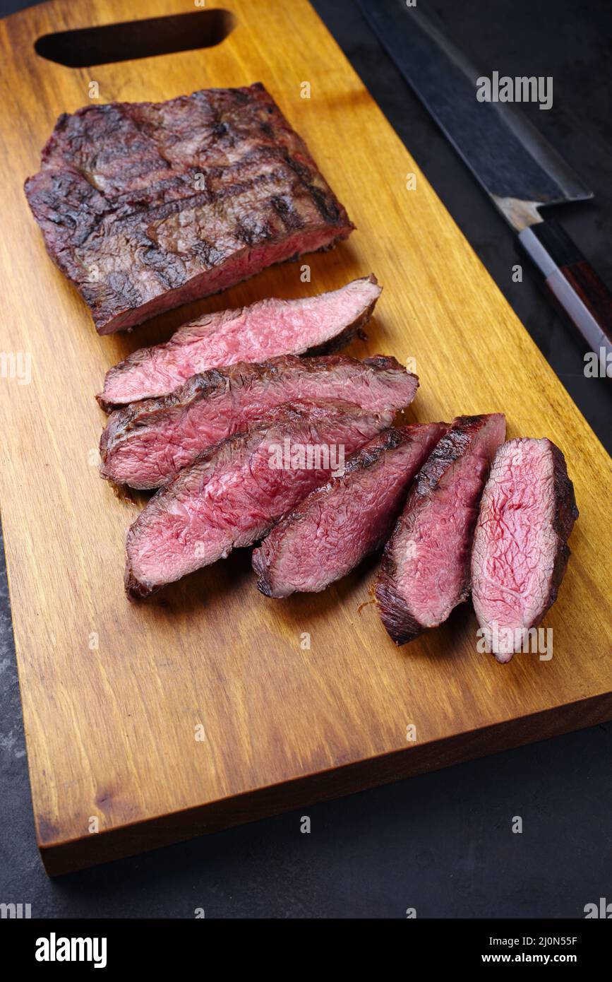 Traditional barbecue wagyu gourmet bavette steak served as close-up on ...