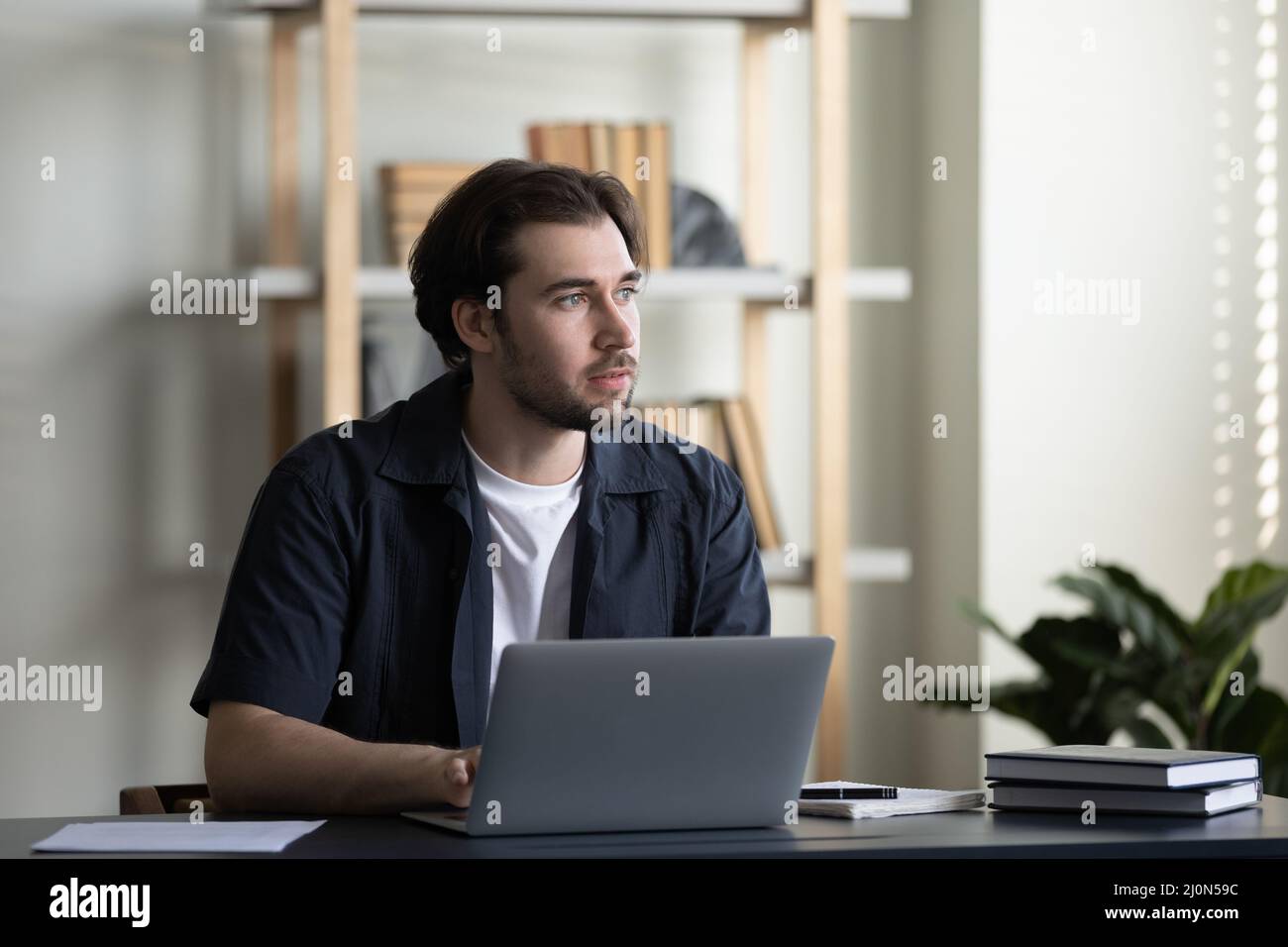 Serious man thinking future hi-res stock photography and images - Alamy