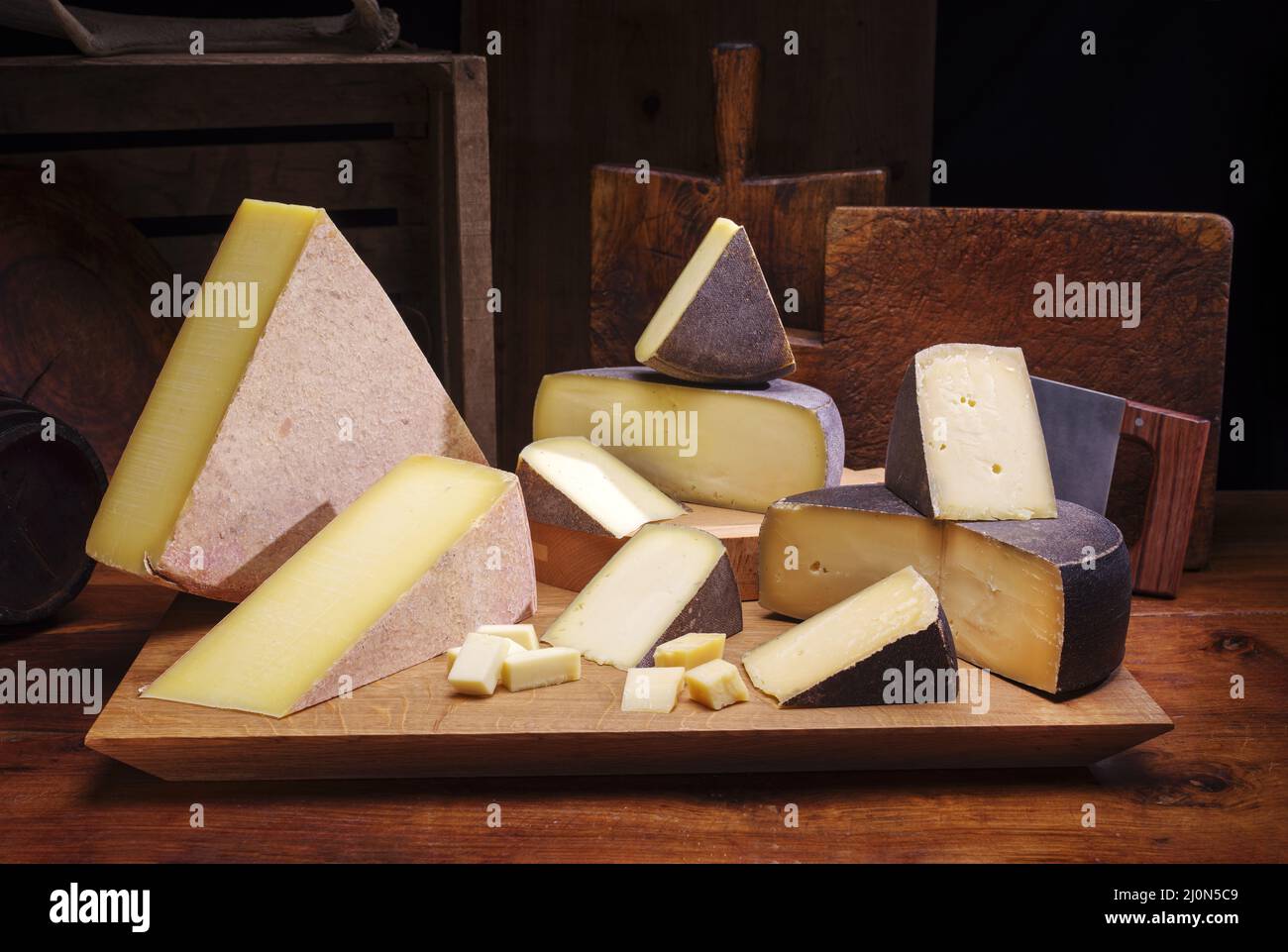 Traditional aged mountain cheese of the Alps offered as loaf and piece ...