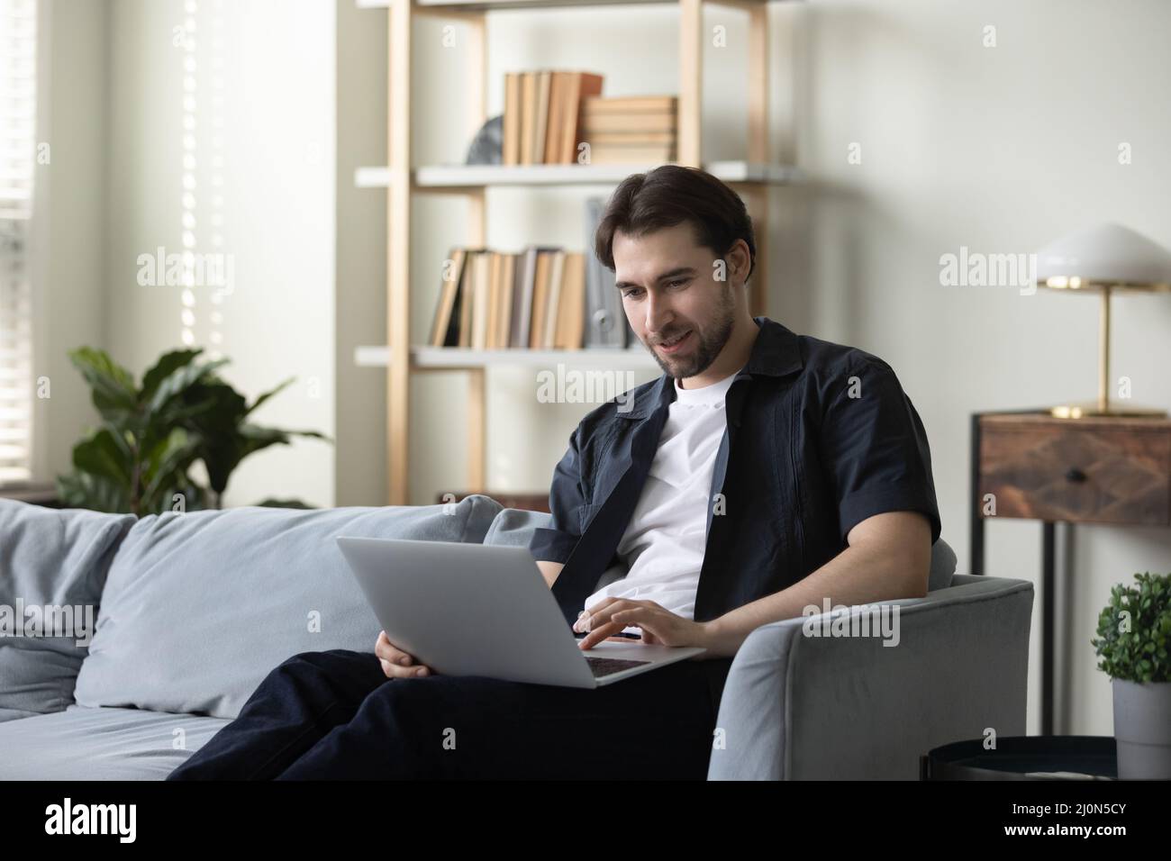 Focused cheerful positive smiling hi-res stock photography and images ...