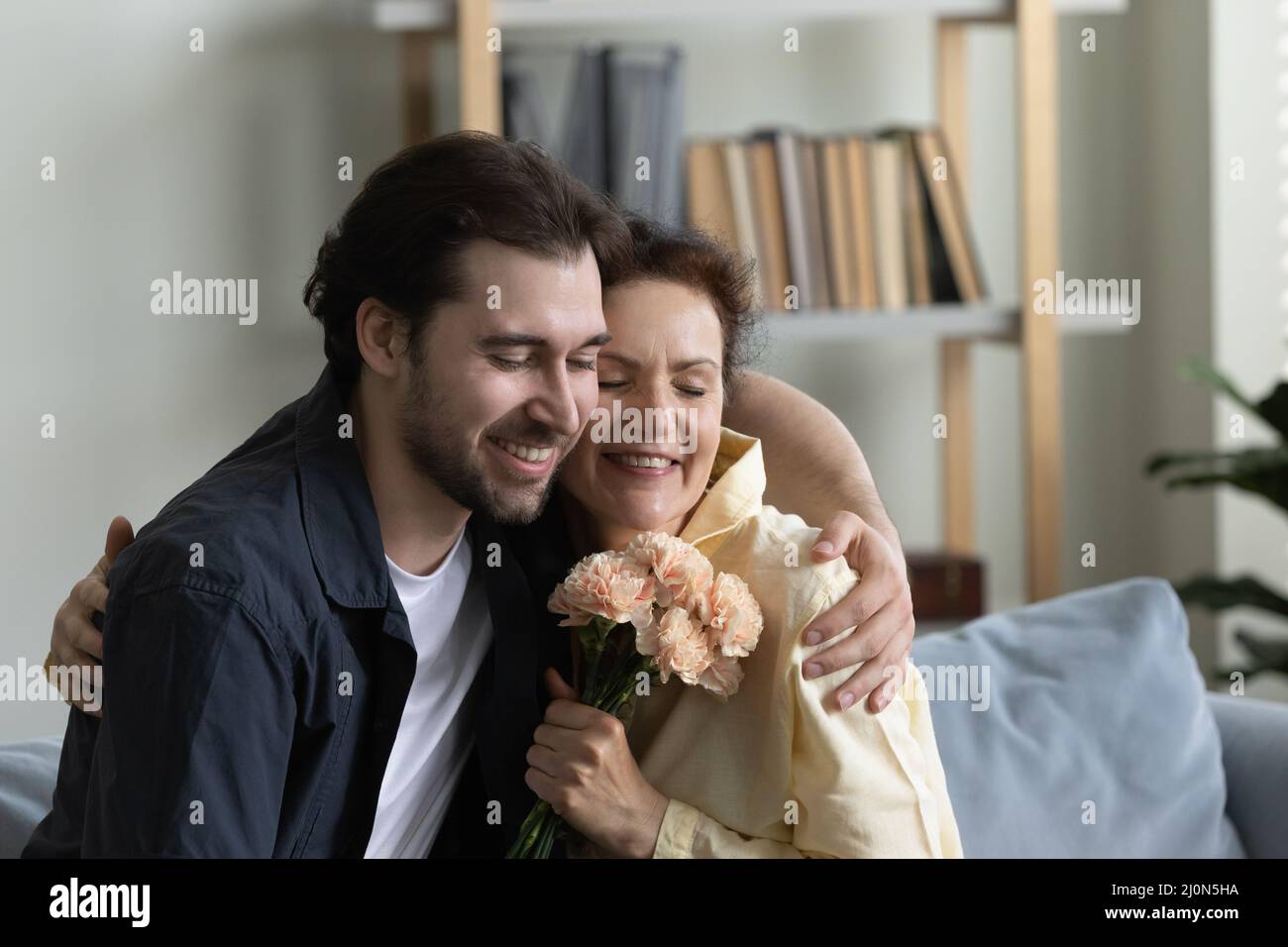 Son giving flower hi-res stock photography and images - Alamy