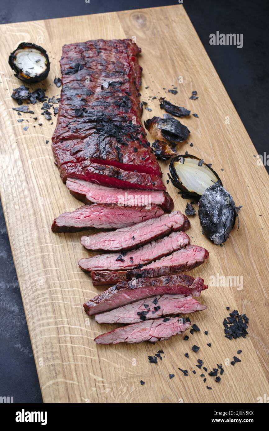Traditional barbecue wagyu gourmet bavette steak served as close-up on ...