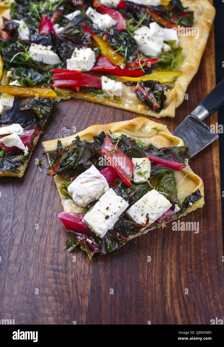 Traditional Italian backed flat bread with mangel vegetable and feta ...
