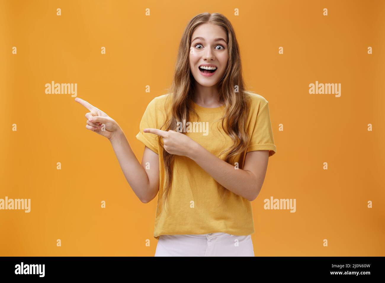 Portrait of wondered and amazed young excited girl with scar on arm and ...