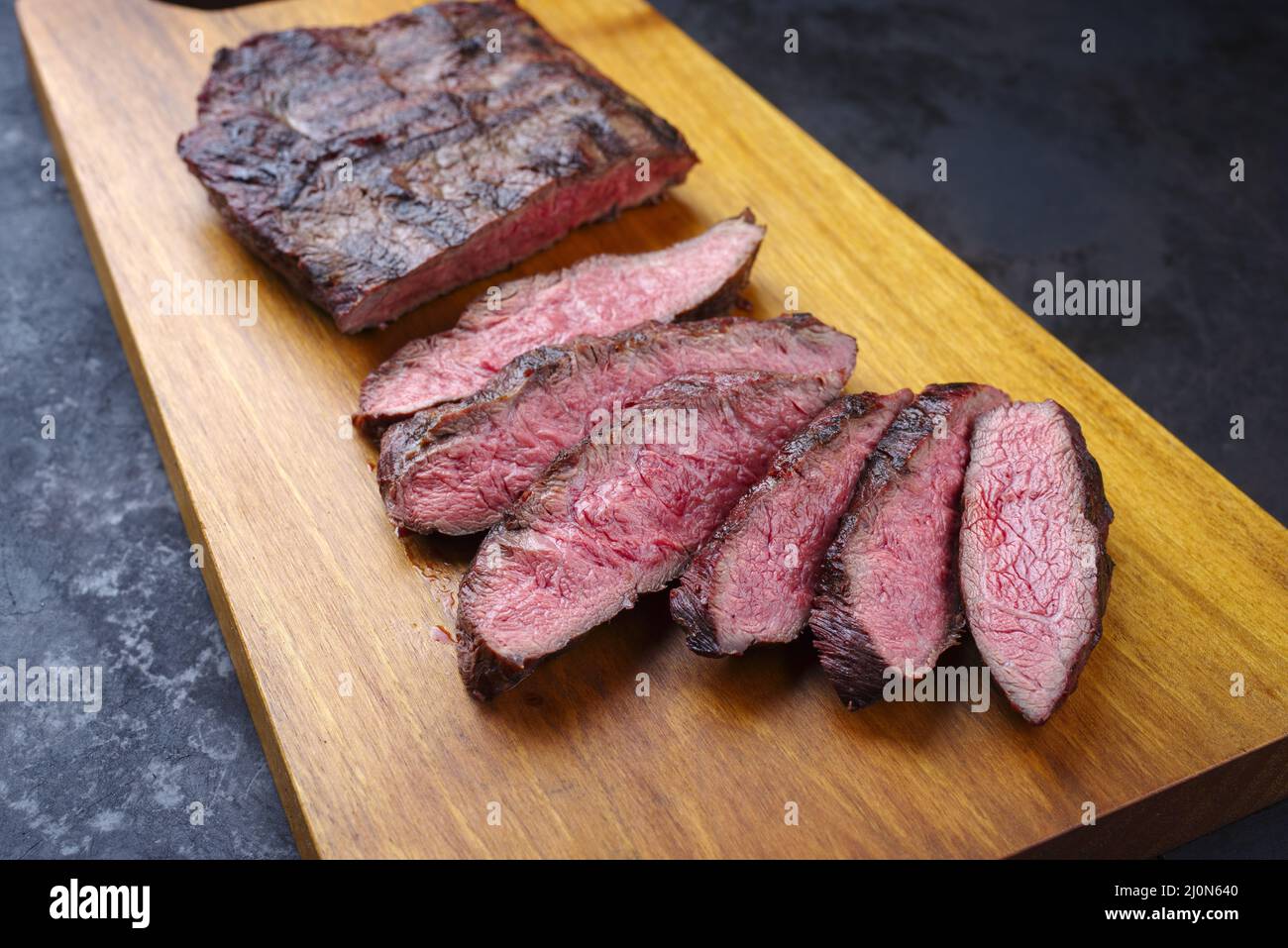 Traditional barbecue wagyu gourmet bavette steak served as close-up on ...