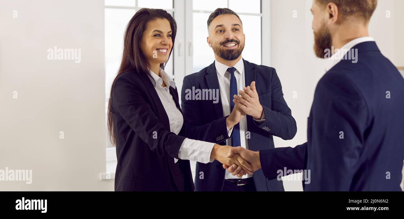 Satisfied smiling business partners confirm their successful agreement ...