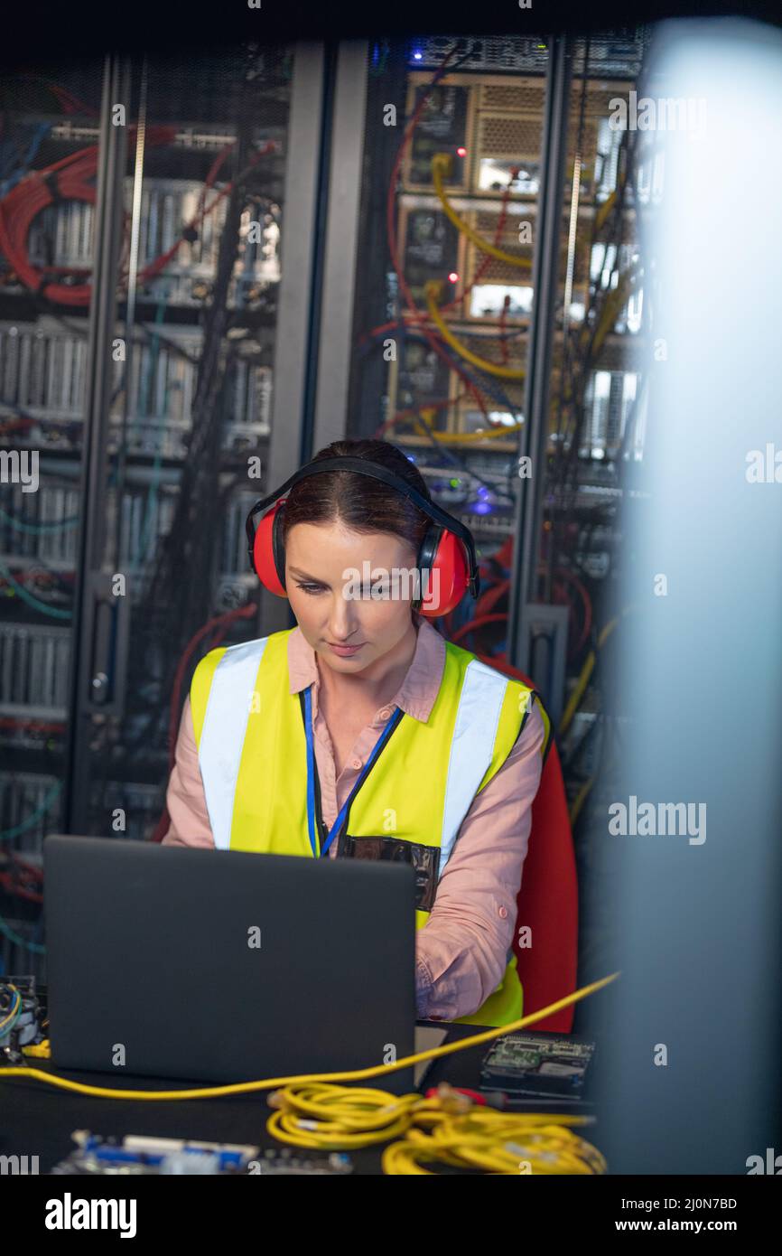 Woman wearing ear plugs hi-res stock photography and images - Alamy