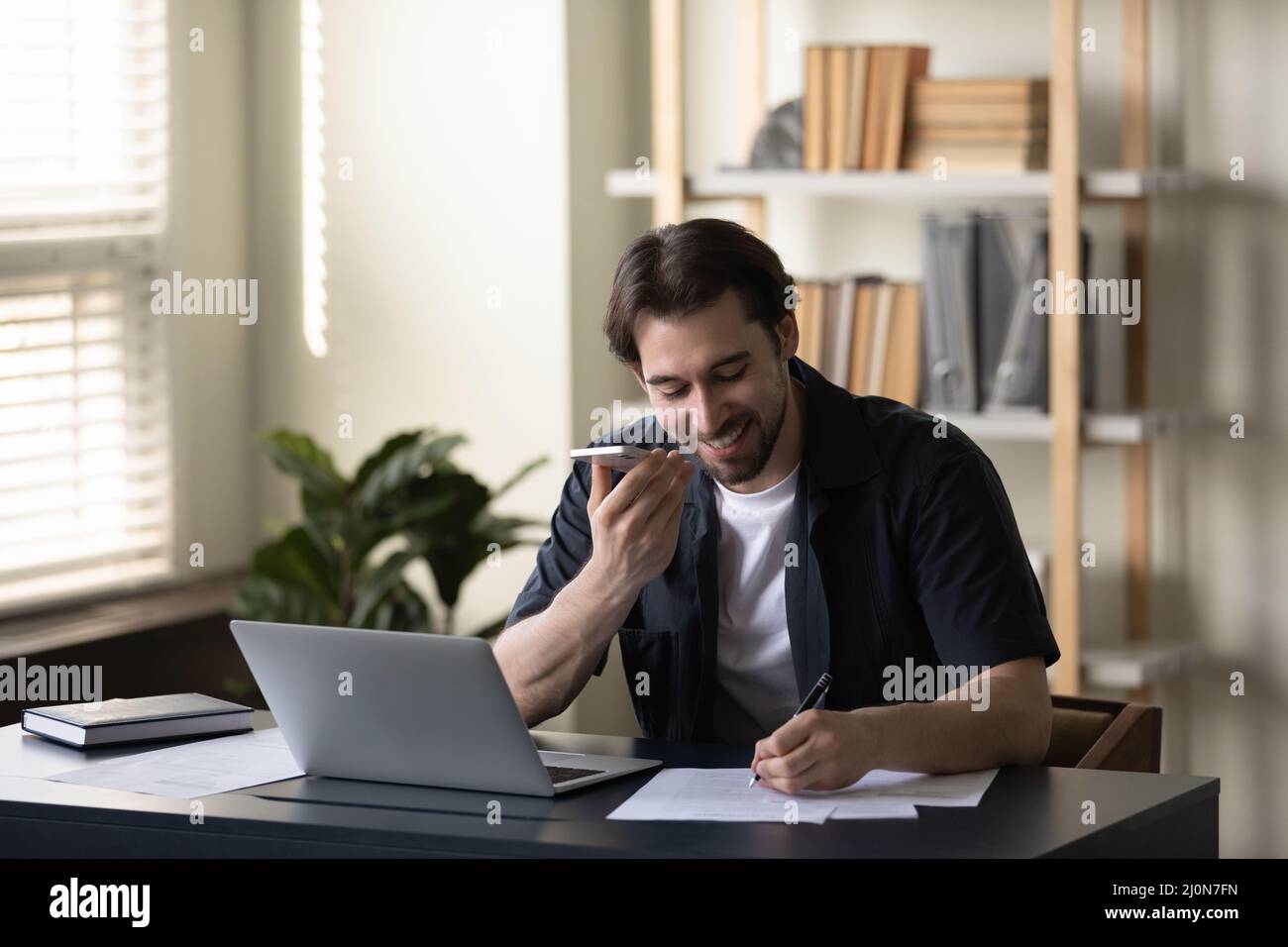 Positive successful business professional man talking on speaker Stock ...