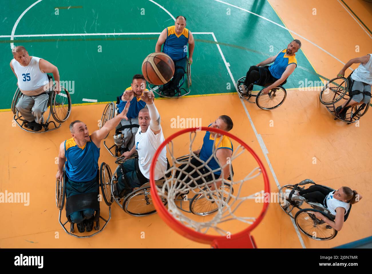 A photo of basketball teams with disabilities with the selector in the ...