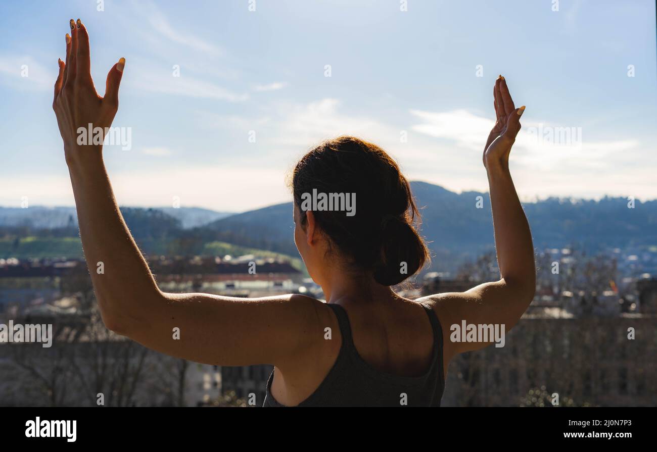 woman raising her arms Stock Photo - Alamy